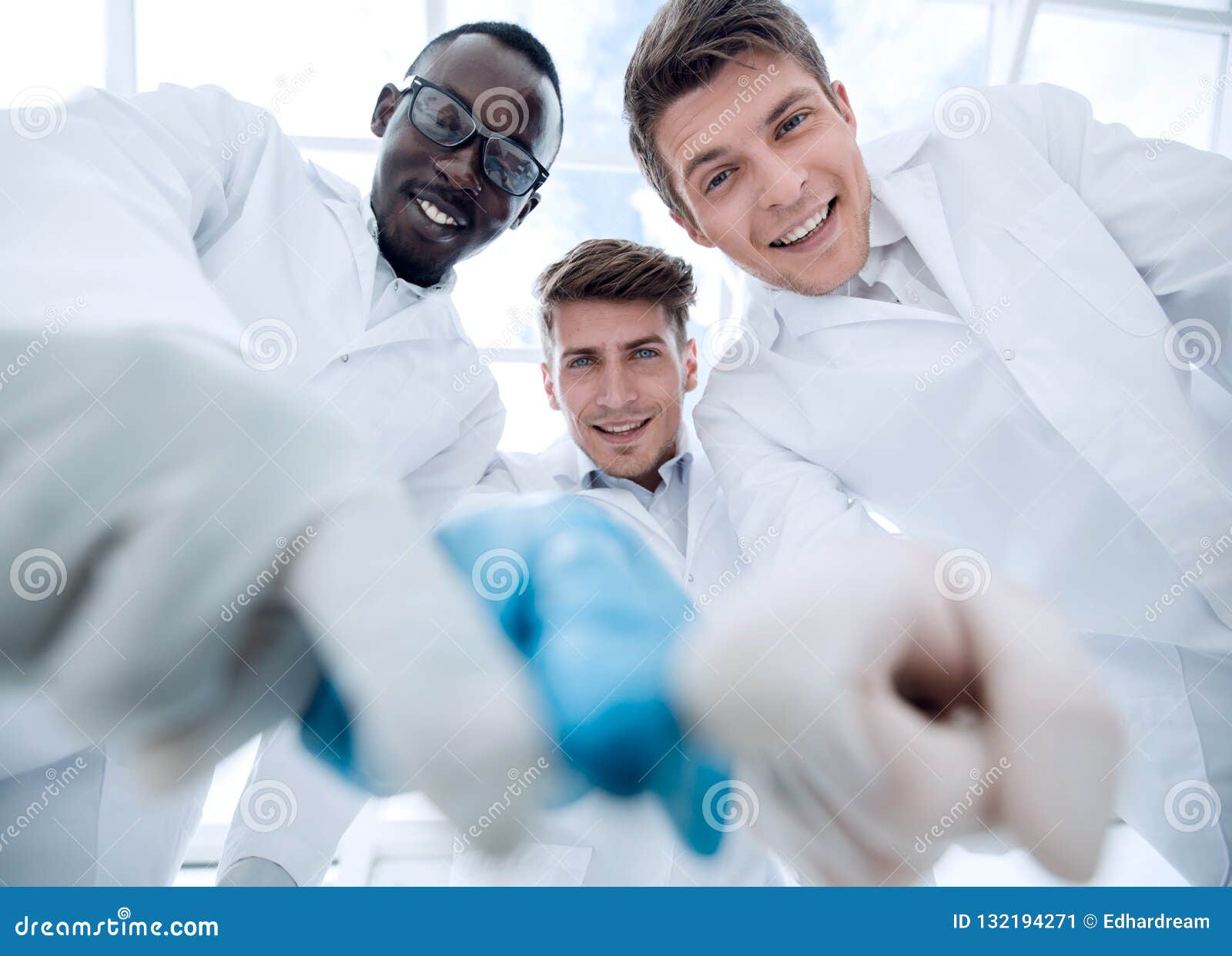Group of Scientists Pointing To the Laboratory Table Stock Image ...