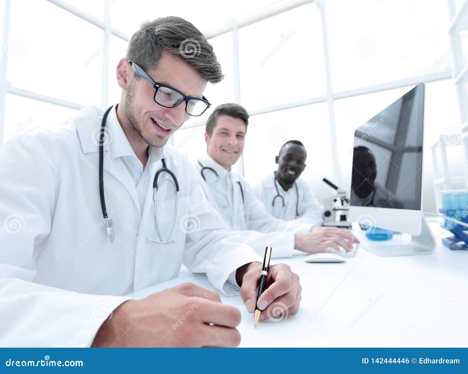 Group of Scientists Sitting at the Laboratory Table Stock Photo - Image ...