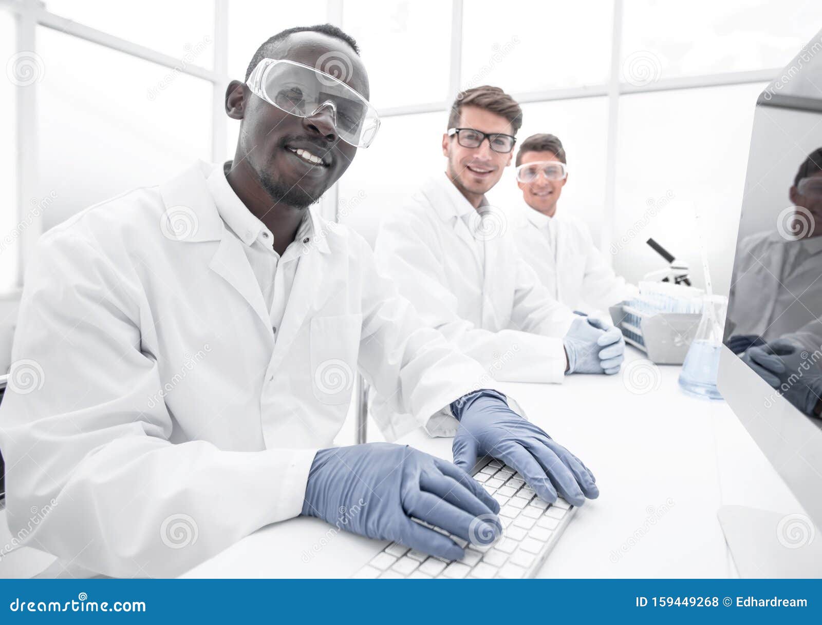 Group of Scientists Sitting at the Laboratory Table Stock Photo - Image ...
