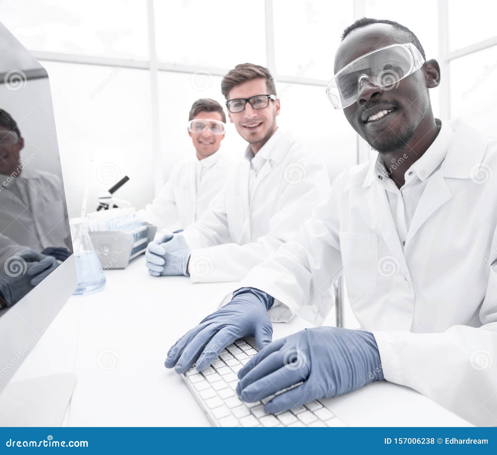 Group of Scientists Sitting at the Laboratory Table Stock Photo - Image ...