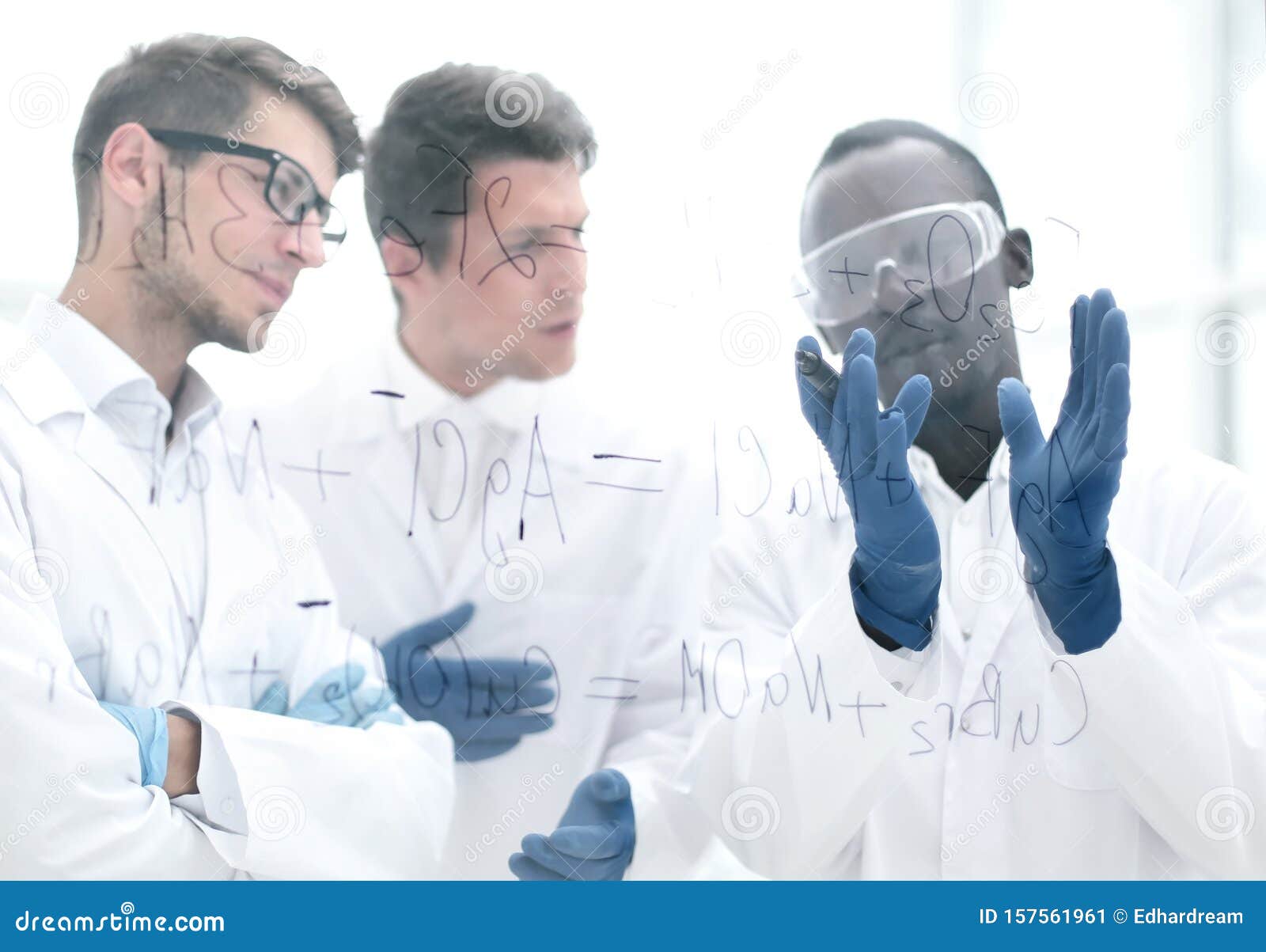 Group of Scientists Talking Standing Near a Glass Board. Stock Image ...