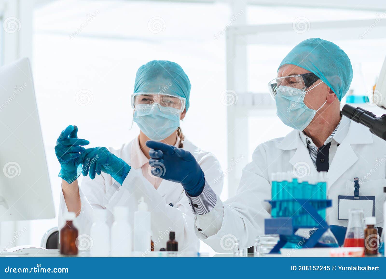 Group of Scientists Using a Computer To Classify Data. Stock Image ...