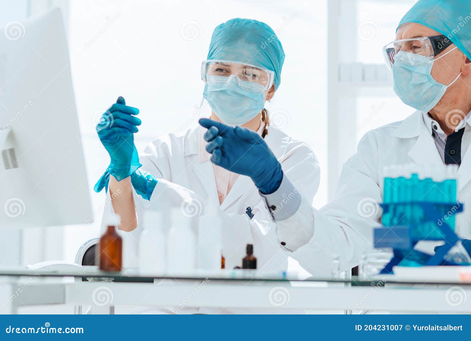 Group of Scientists Using a Computer To Classify Data. Stock Image ...