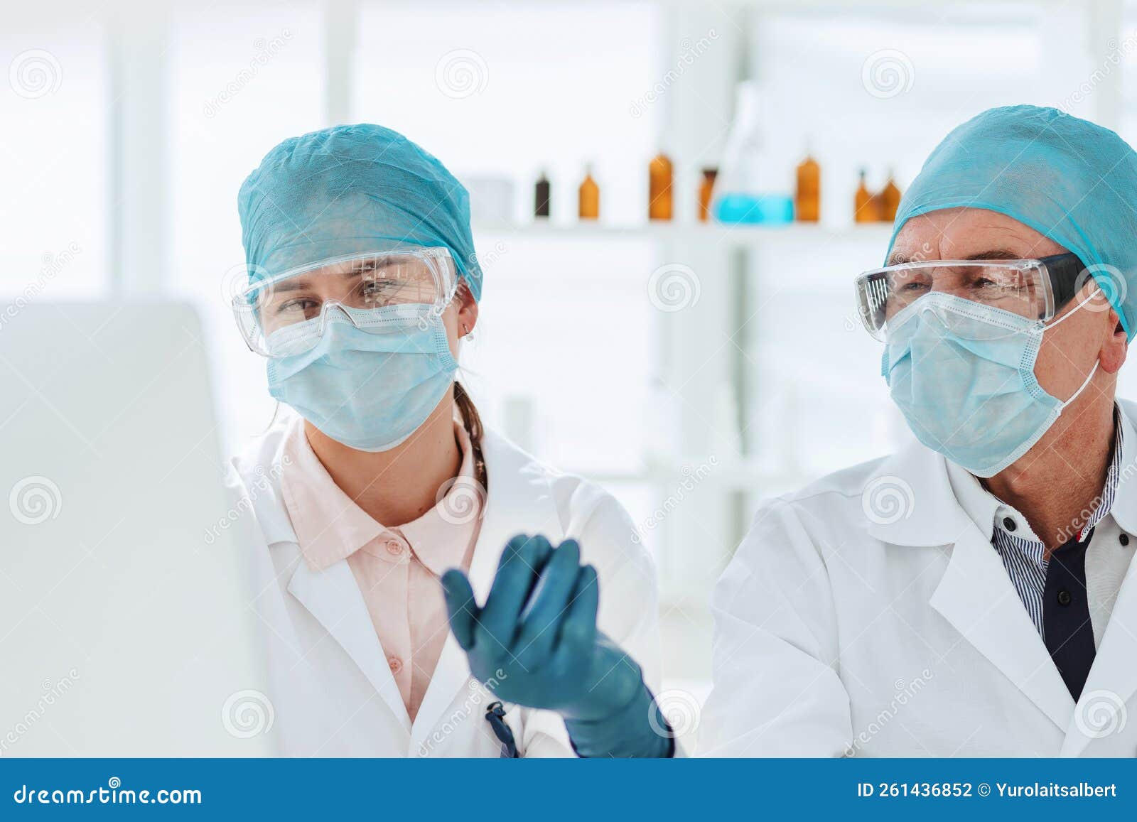Group of Scientists Using a Computer To Classify Data. Stock Photo ...