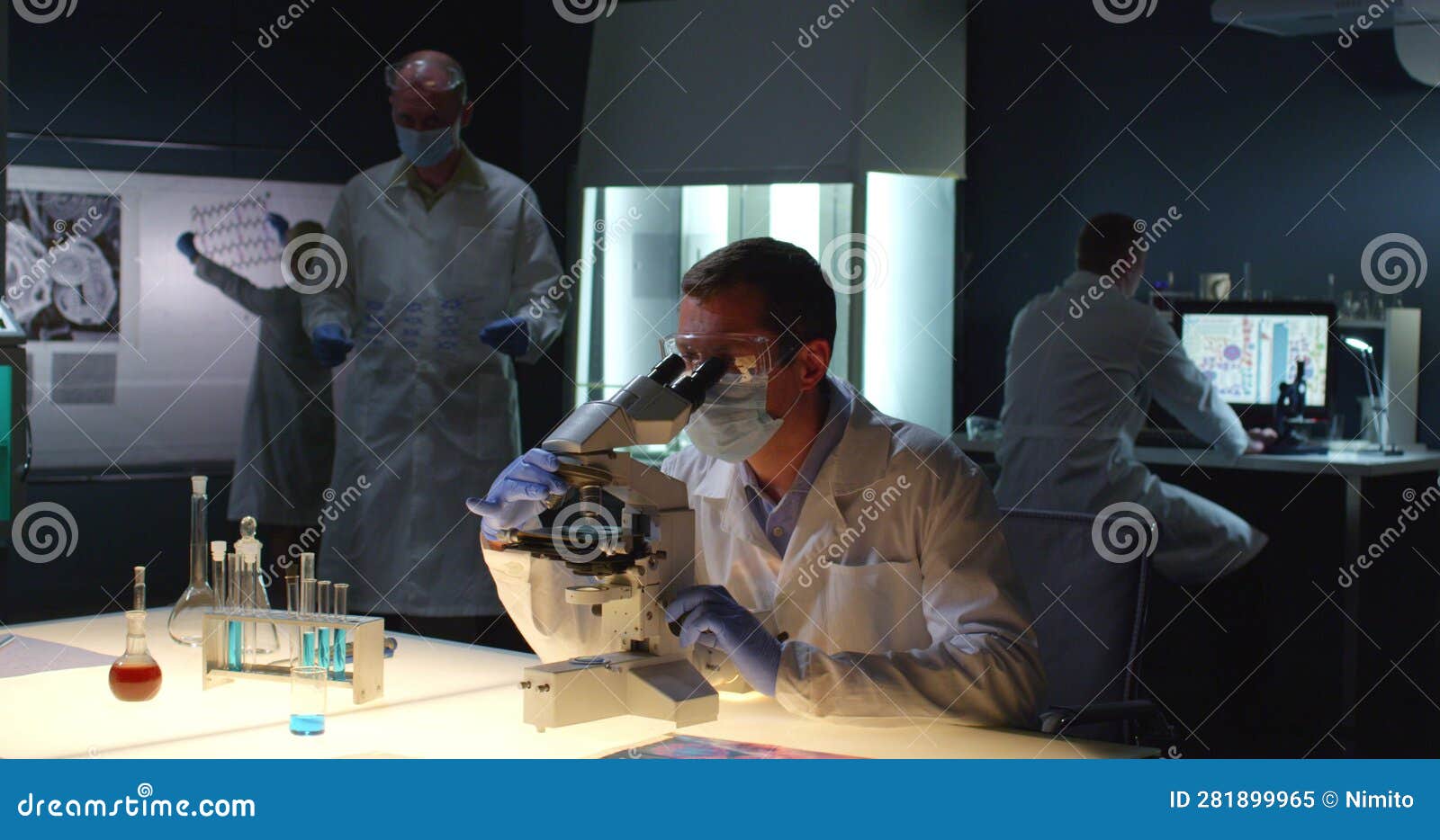 Group of Scientists Work in Microbiology Laboratory Stock Image - Image ...