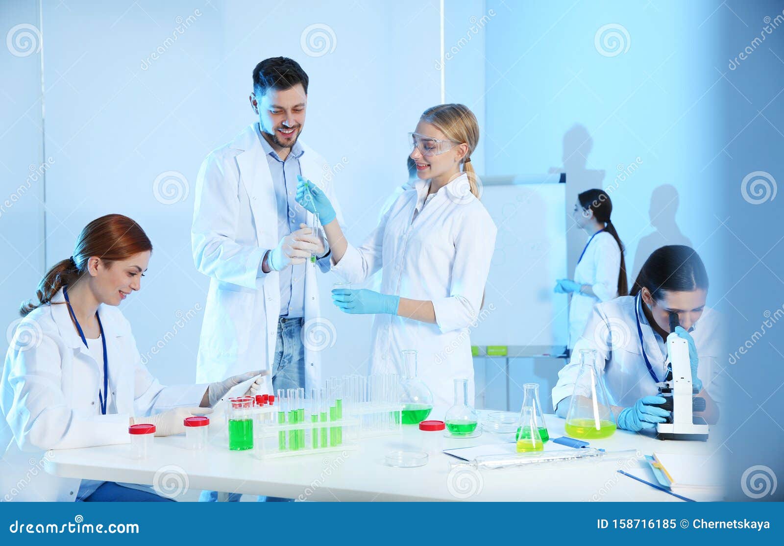 Group of Scientists Working in Chemistry Laboratory Stock Image - Image ...