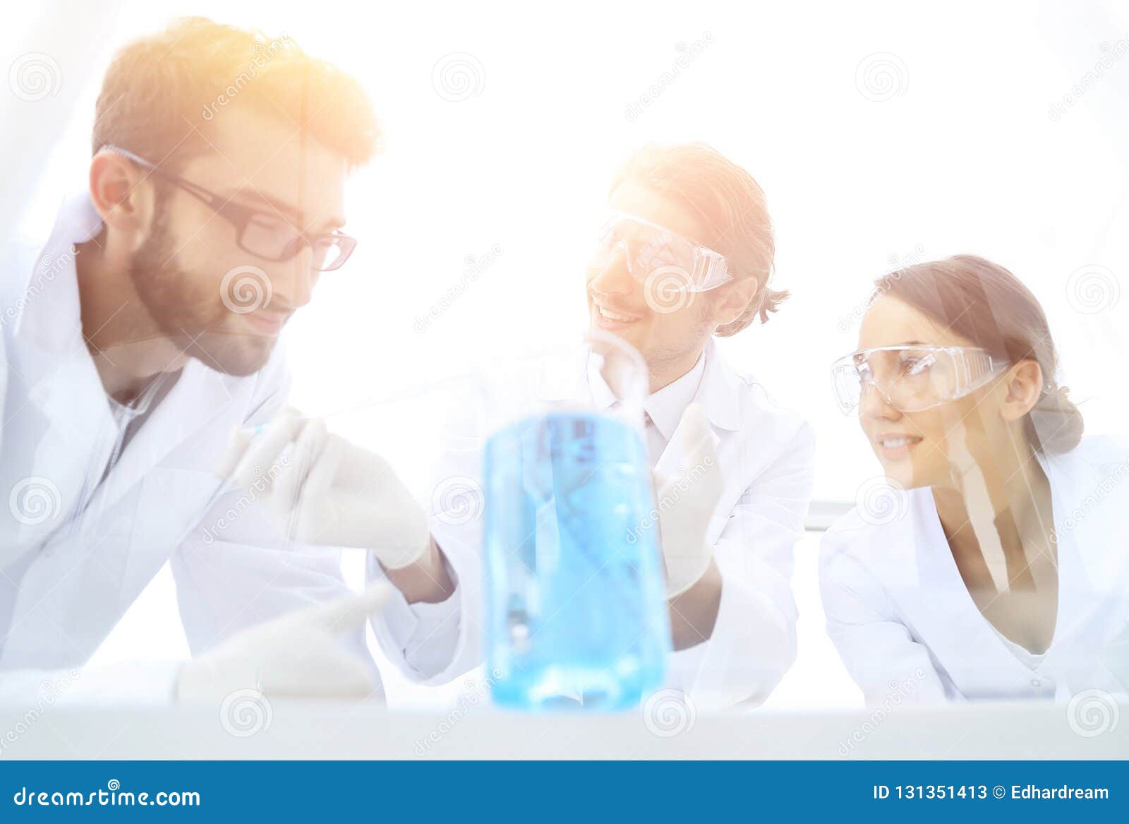 Group of Scientists Working on an Experiment at the Laboratory Stock ...
