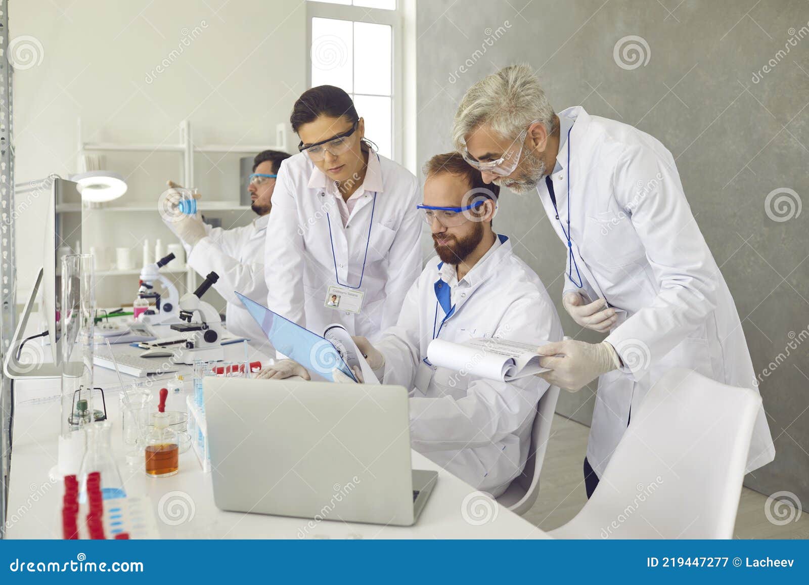 Group of Scientists Working in Laboratory, Doing Research and ...