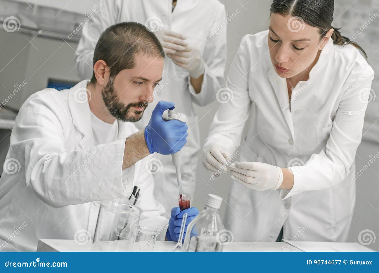 Group of Scientists Working with Liquid Test Tube Samples Stock Image ...