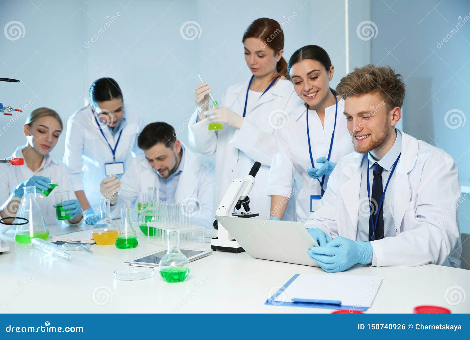Group of Scientists Working in Modern Laboratory Stock Photo - Image of ...