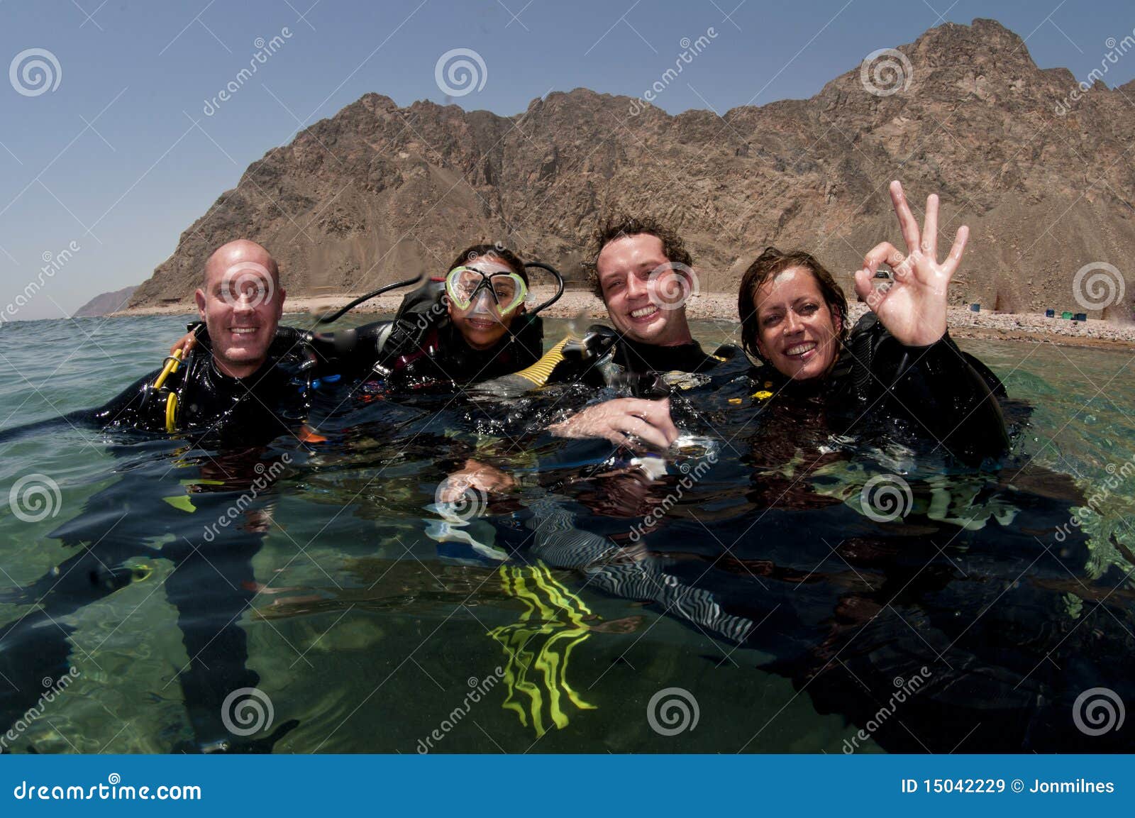 Group of Scuba Divers on Surface Stock Image - Image of tank, mask ...