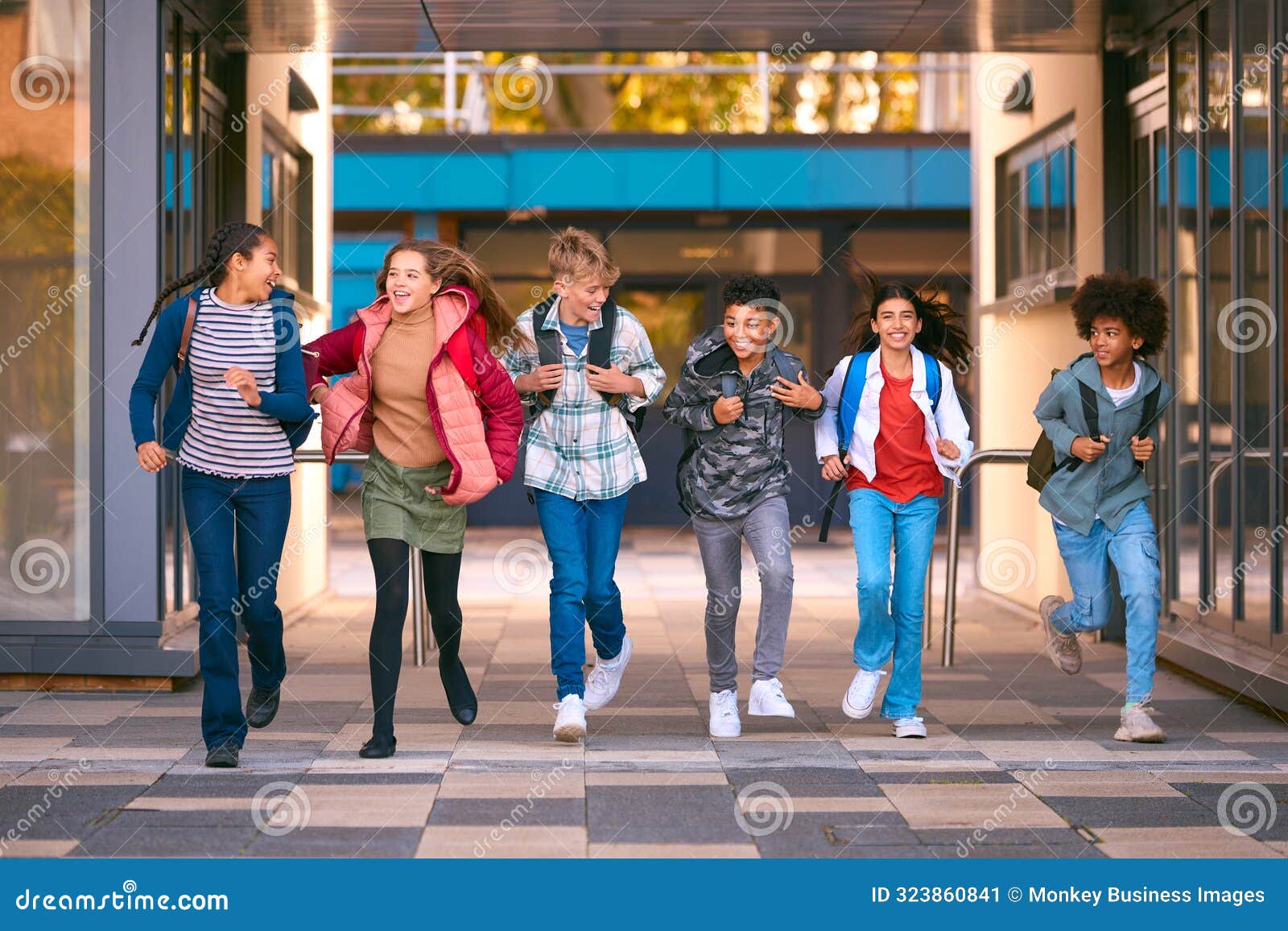 Group of Secondary or High School Pupils Running Towards Camera Outside ...