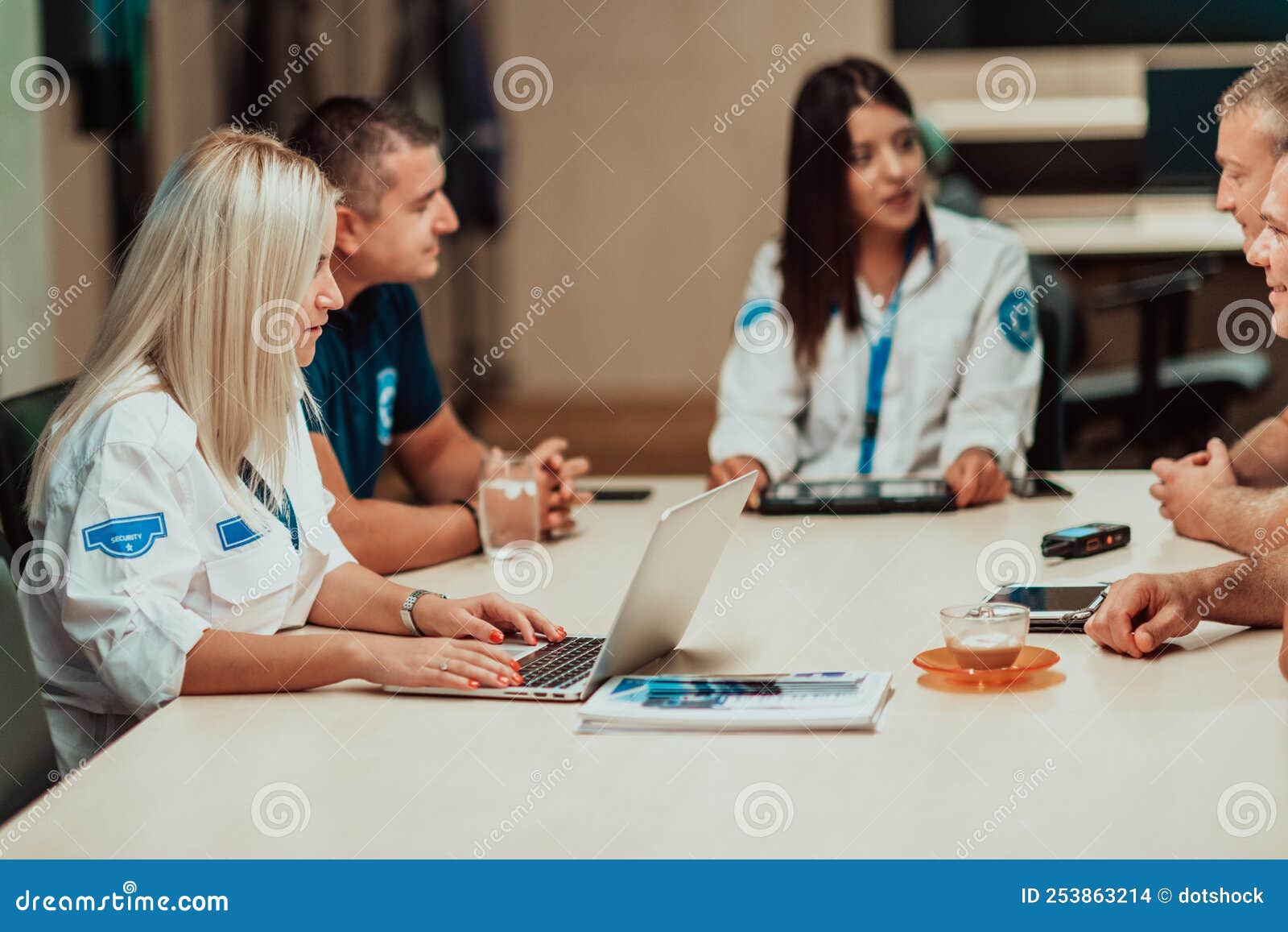 Group of Security Guards Sitting and Having Briefing in the System ...