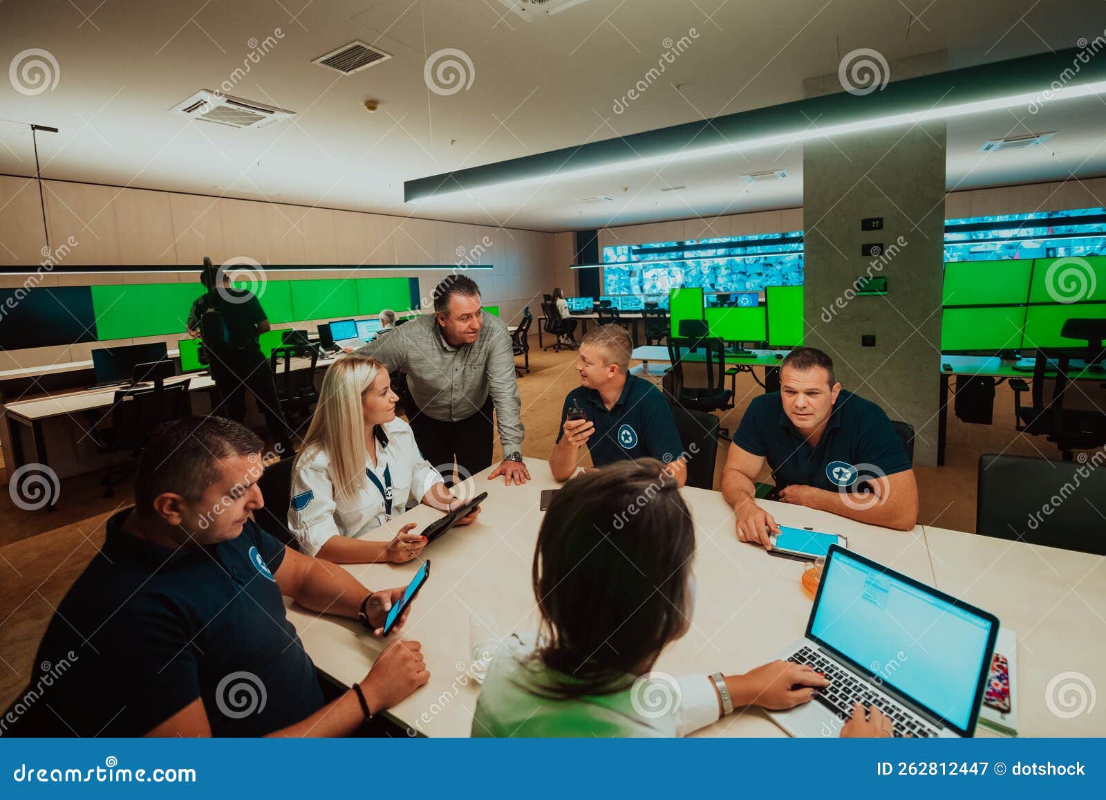Group of Security Guards Sitting and Having Briefing in the System ...