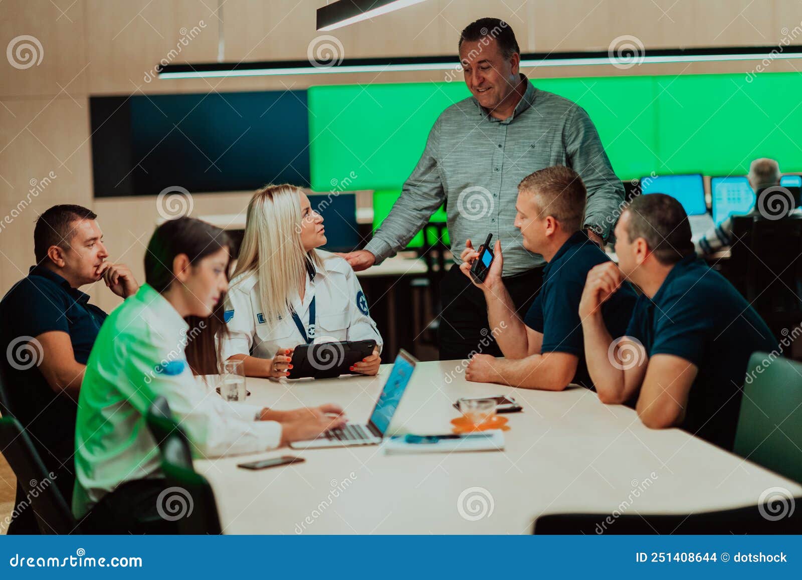Group of Security Guards Sitting and Having Briefing in the System ...