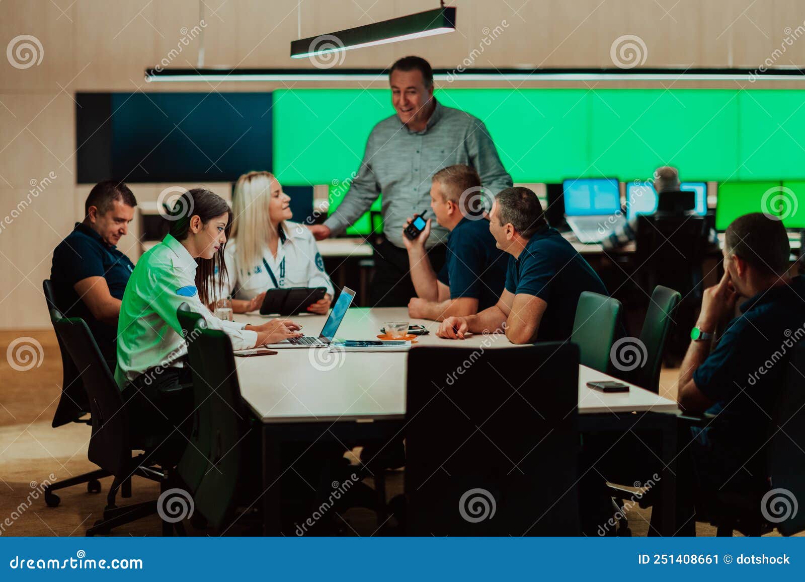 Group of Security Guards Sitting and Having Briefing in the System ...