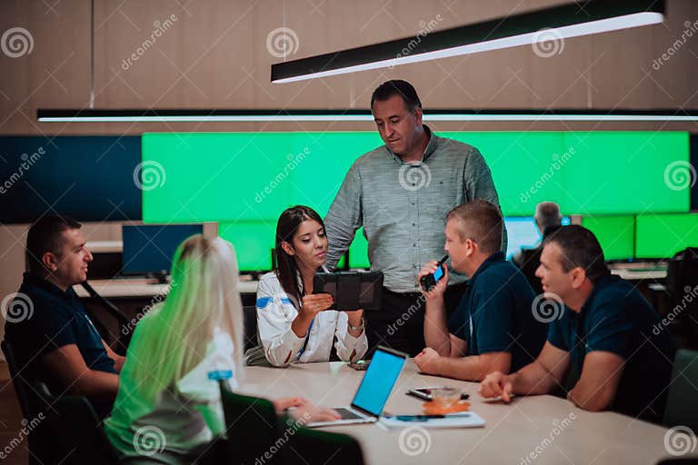 Group of Security Guards Sitting and Having Briefing in the System ...