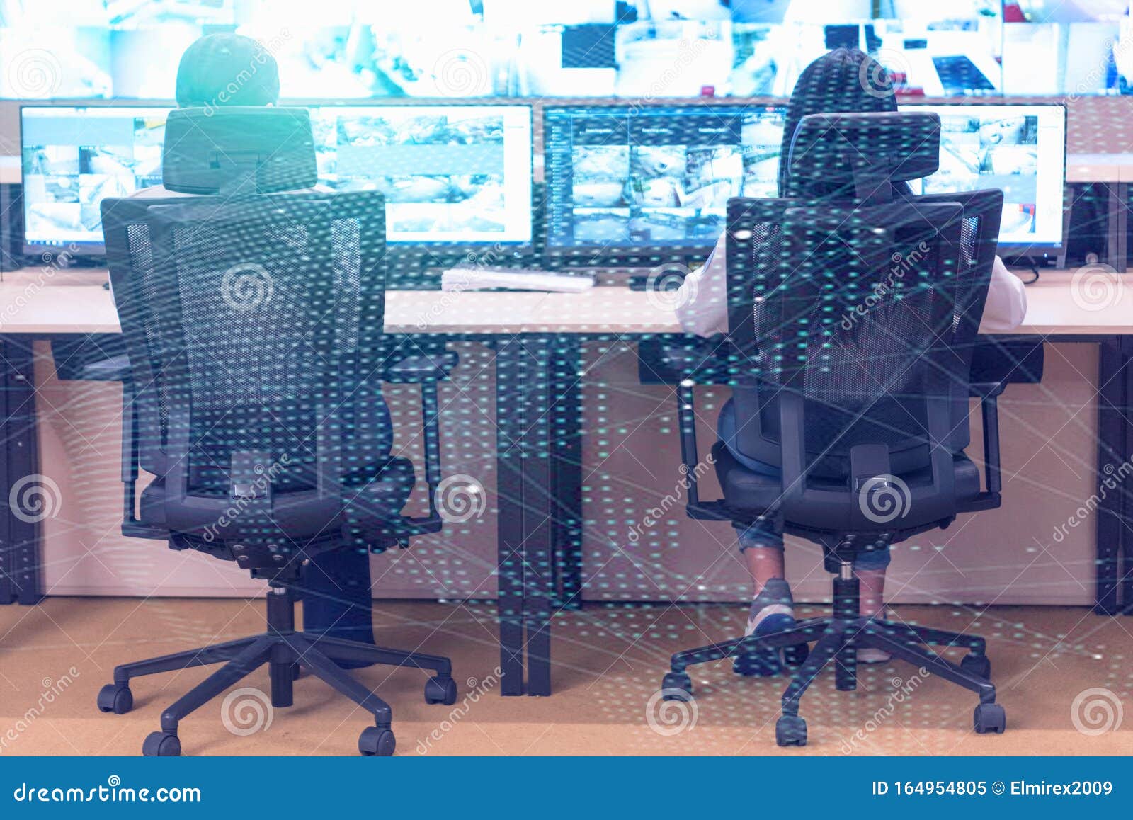 Group of Security Guards Working on Computers while Sitting in the Main ...