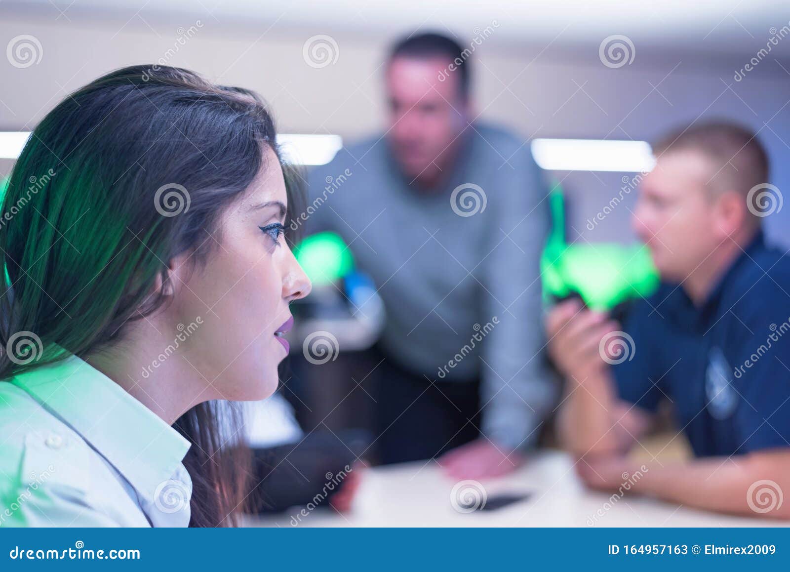 Group of Security Guards Working on Computers while Sitting in the Main ...