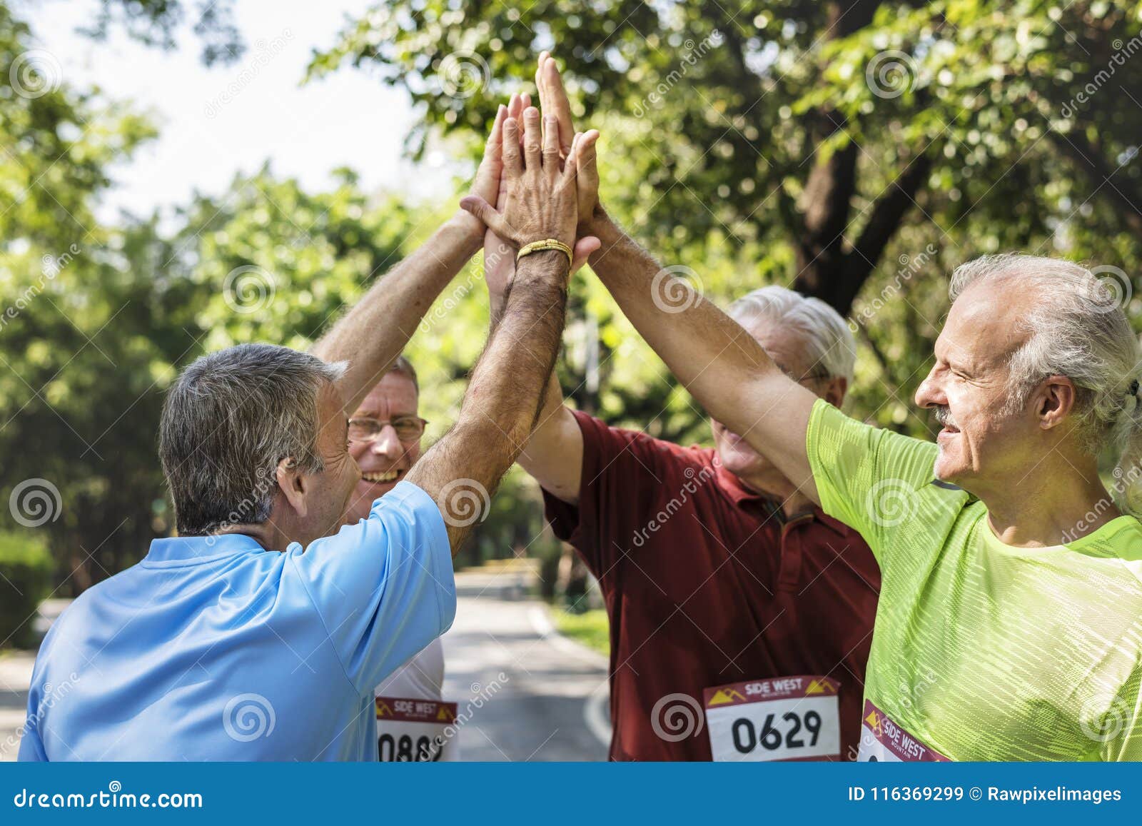 Group of Senior Athletes Giving a High Five Stock Image - Image of ...