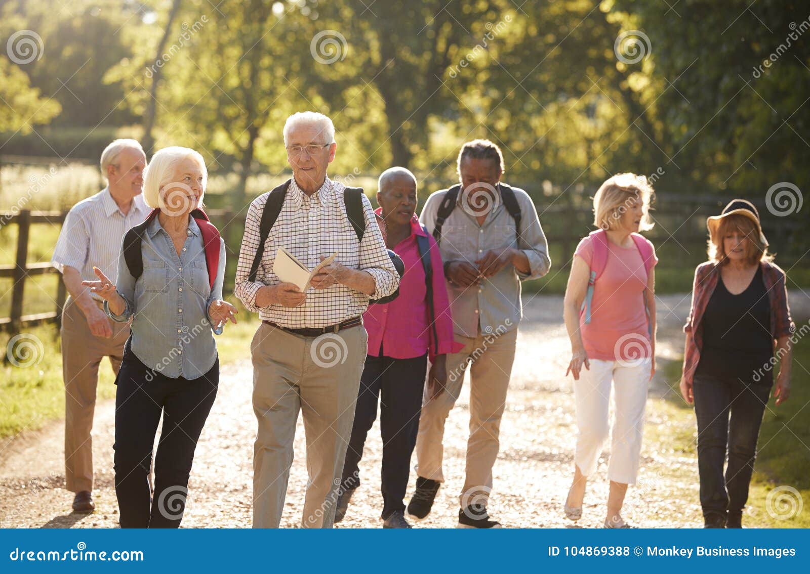 Group of Senior Friends Hiking in Countryside Stock Photo - Image of ...