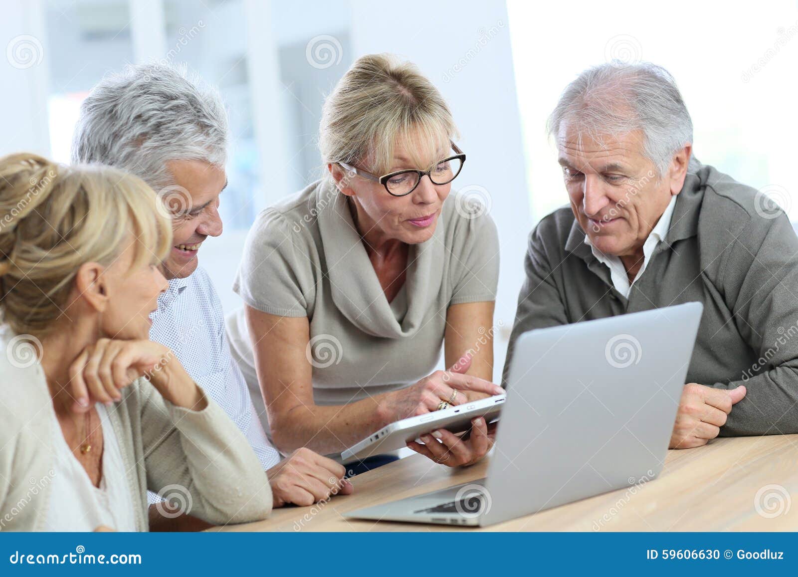 Group of Senior Friends Using Tablet and Laptop Stock Photo - Image of ...
