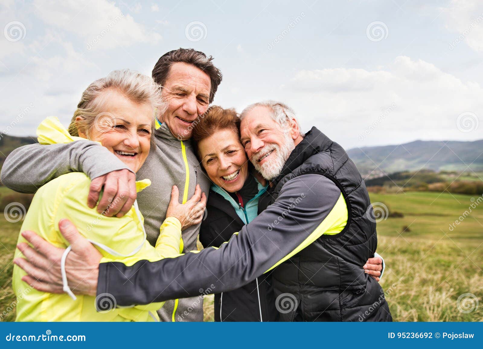 Group of Senior Runners Outdoors, Resting and Hugging. Stock Photo ...