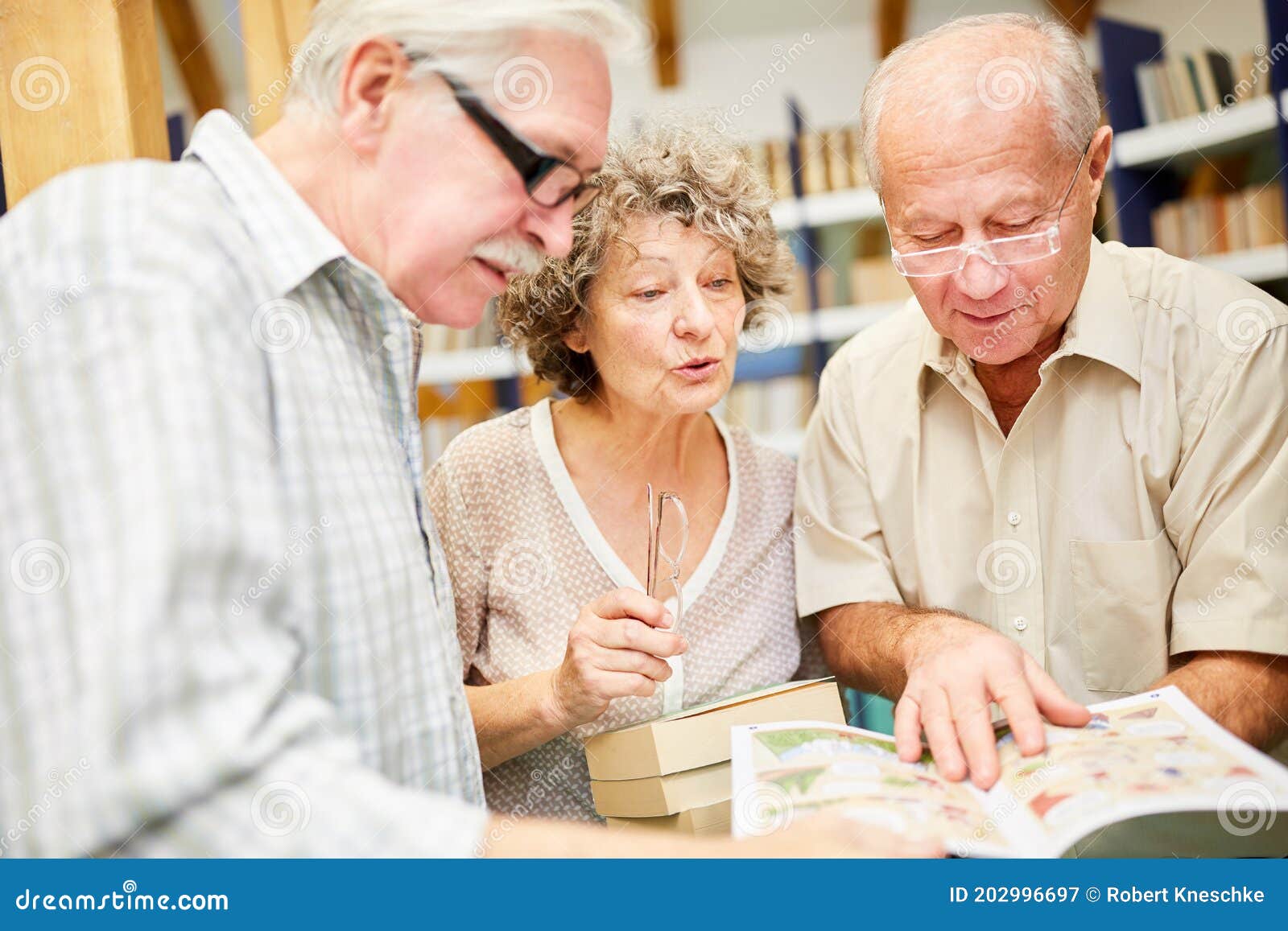 Group of Seniors with Book in Library Stock Image - Image of senior ...