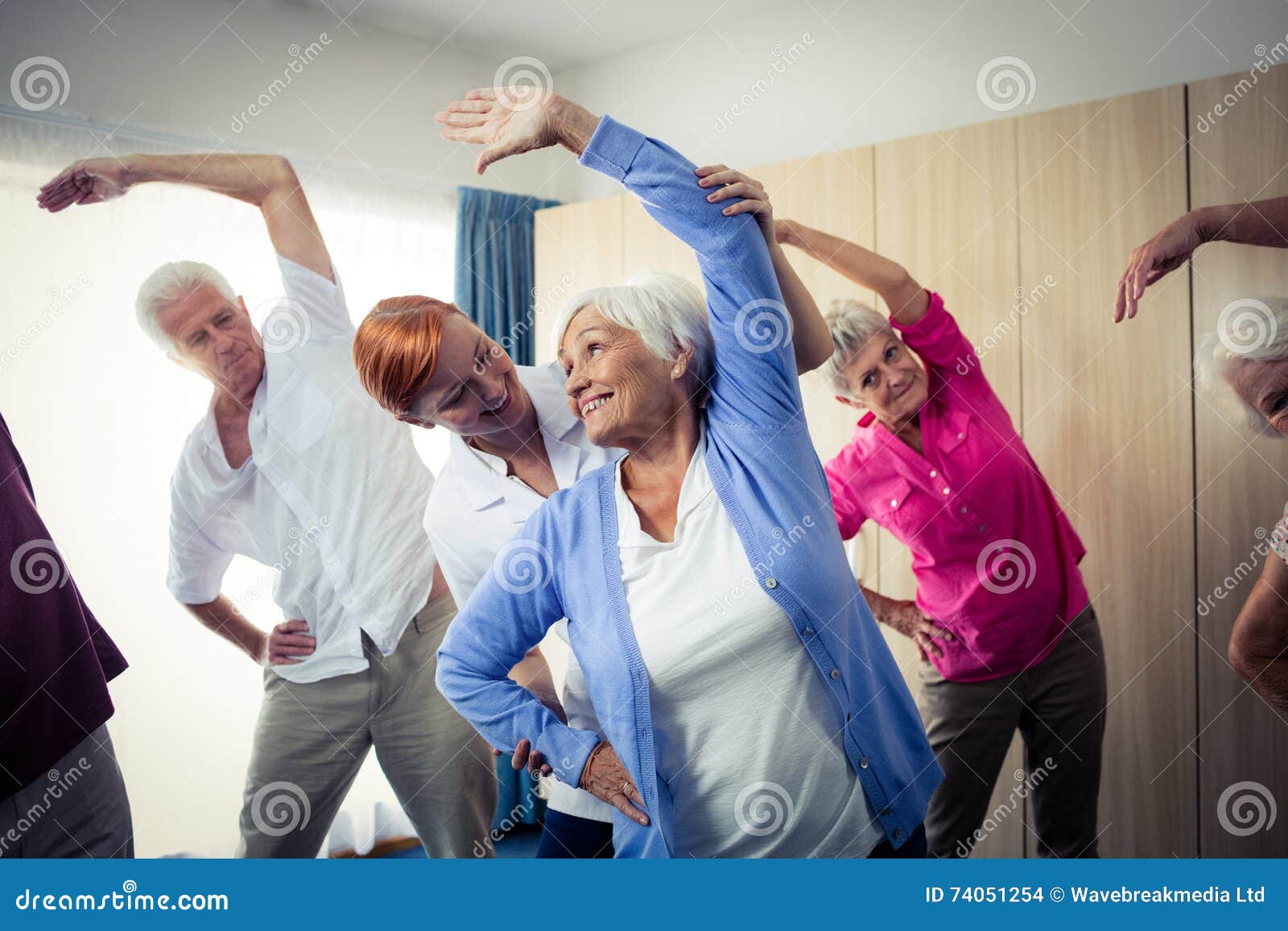 Group of Seniors Doing Exercises with Nurse Stock Photo - Image of ...