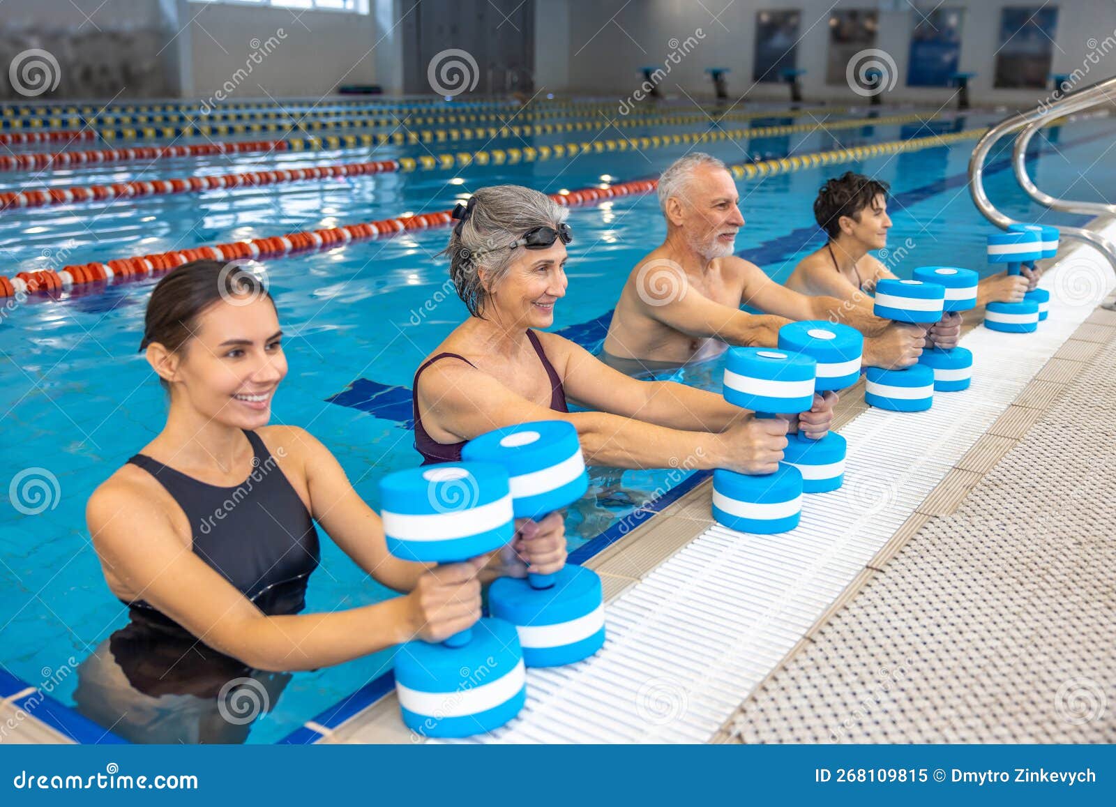 Group of Seniors Having an Exercise with Dumbbels during Water Aerobics ...