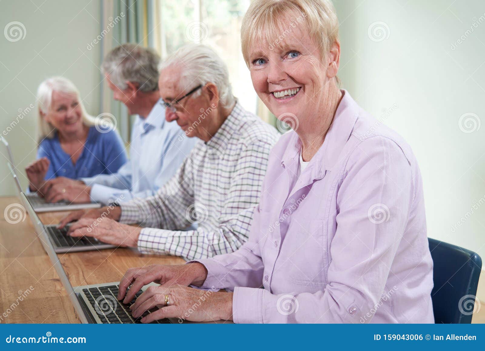 Portrait of Senior Woman with Tutor in Computer Class Stock Photo ...