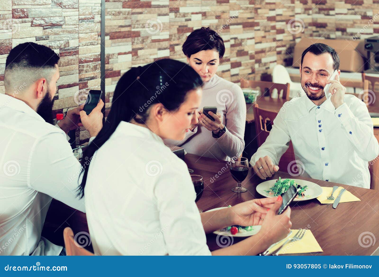 Group of Serious Friends Busy with Phone in Restaurant Stock Image ...