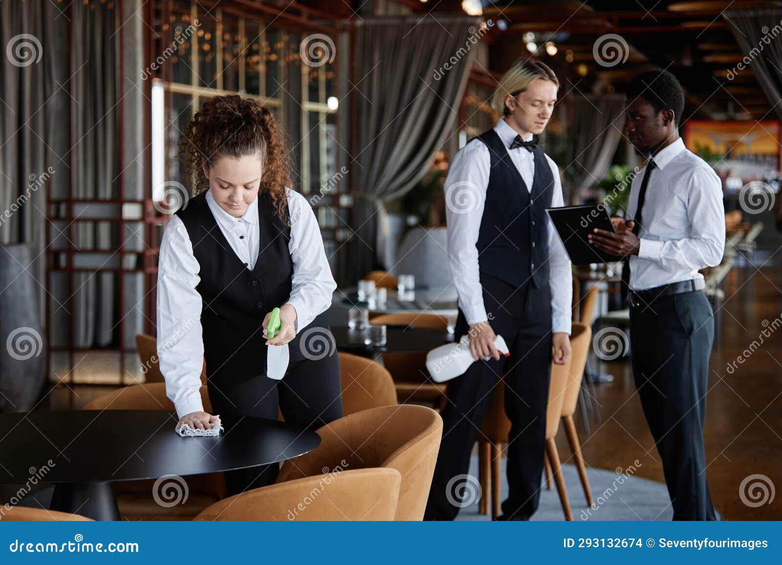 Group of Servers in Classic Uniform Preparing Restaurant for Opening ...