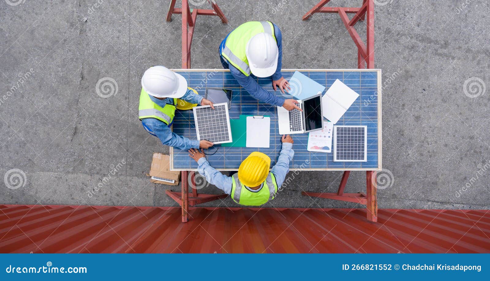 Group of Shipment Worker in Hardhat and Safety Vest Meeting on a Table ...