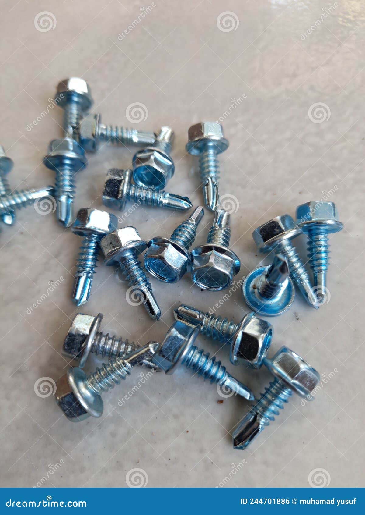 A Group of Silver Colored Threaded Nails Stock Photo - Image of hand ...
