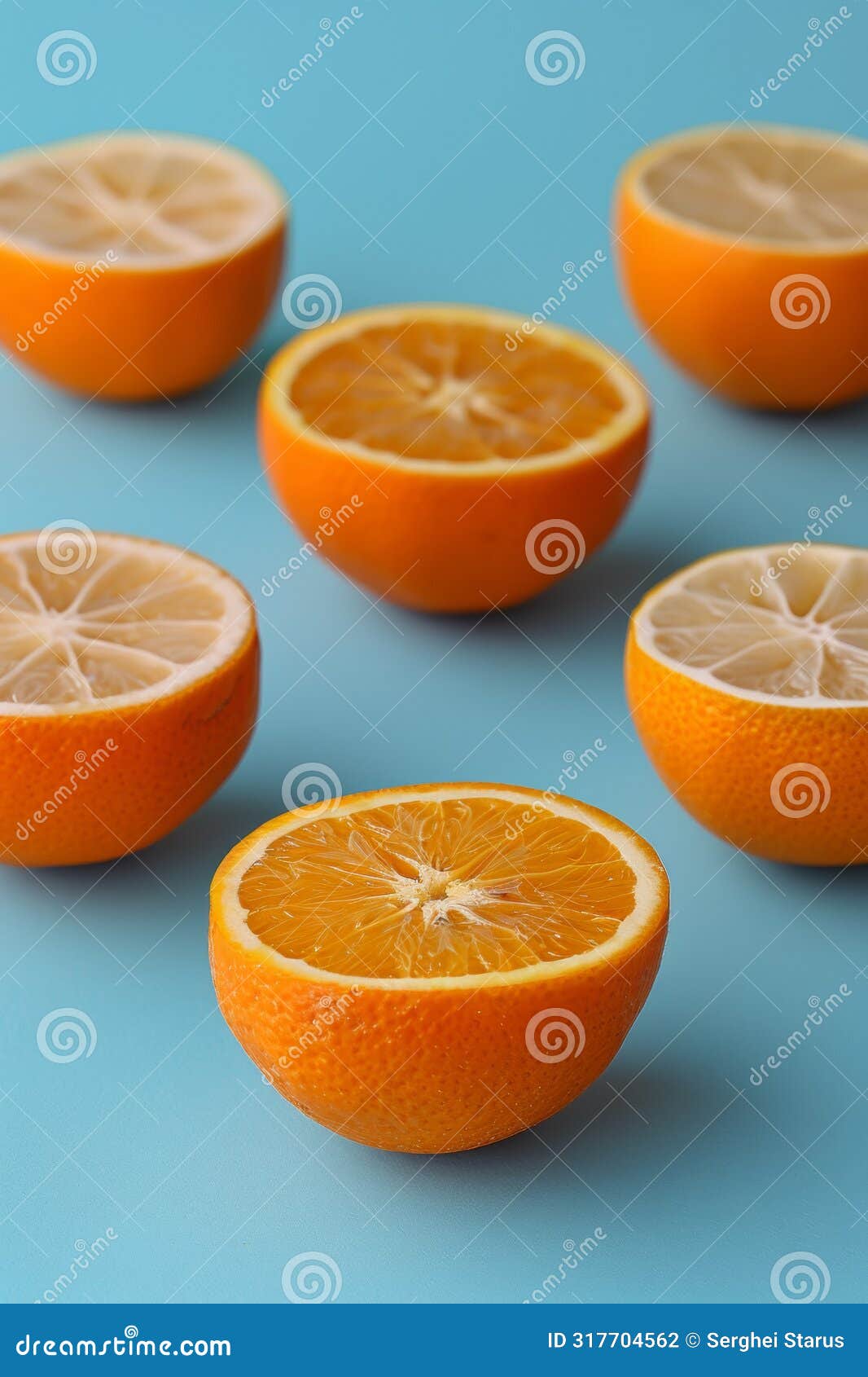 A Group of Six Oranges are Cut into Halves on a Blue Background, AI ...