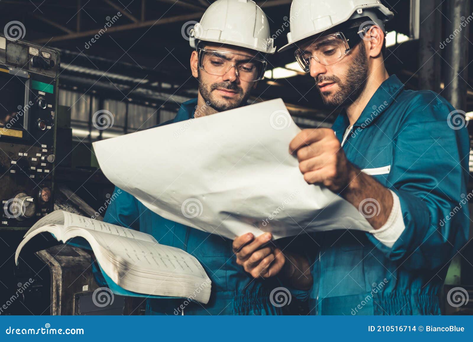 Group of Skillful Factory Workers Using Machine Equipment in Workshop ...