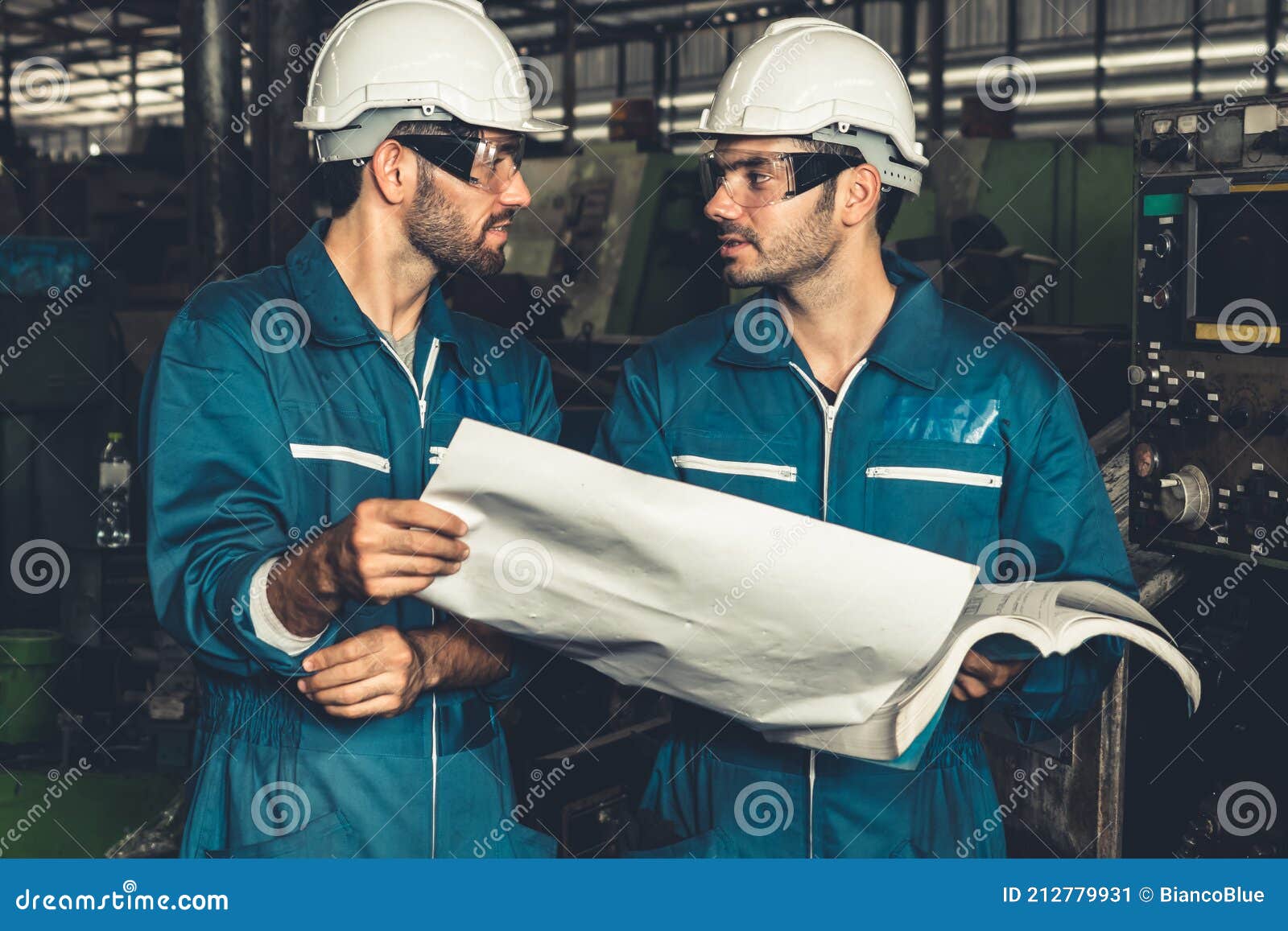 Group of Skillful Factory Workers Using Machine Equipment in Workshop ...