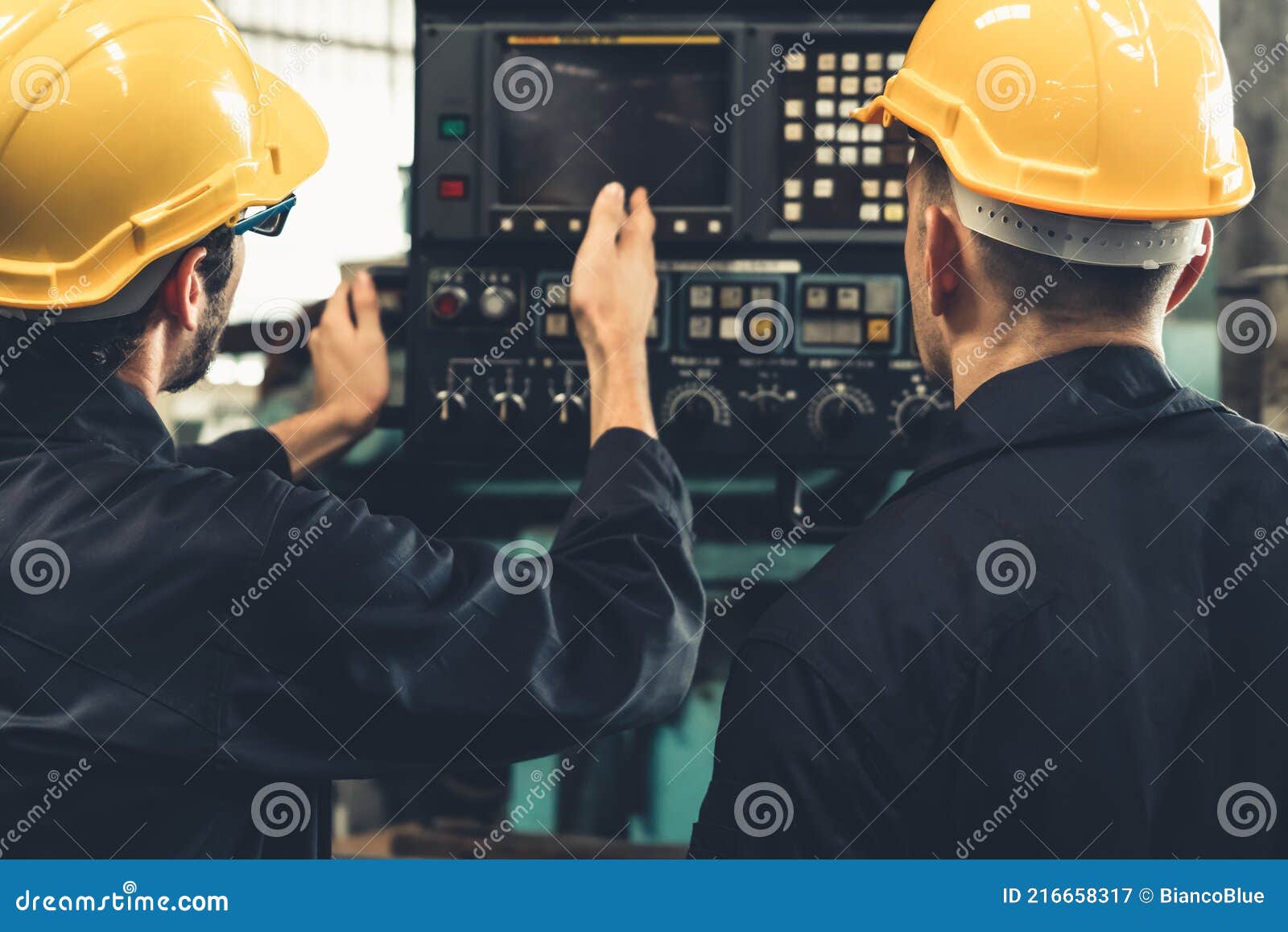 Group of Skillful Factory Workers Using Machine Equipment in Workshop ...