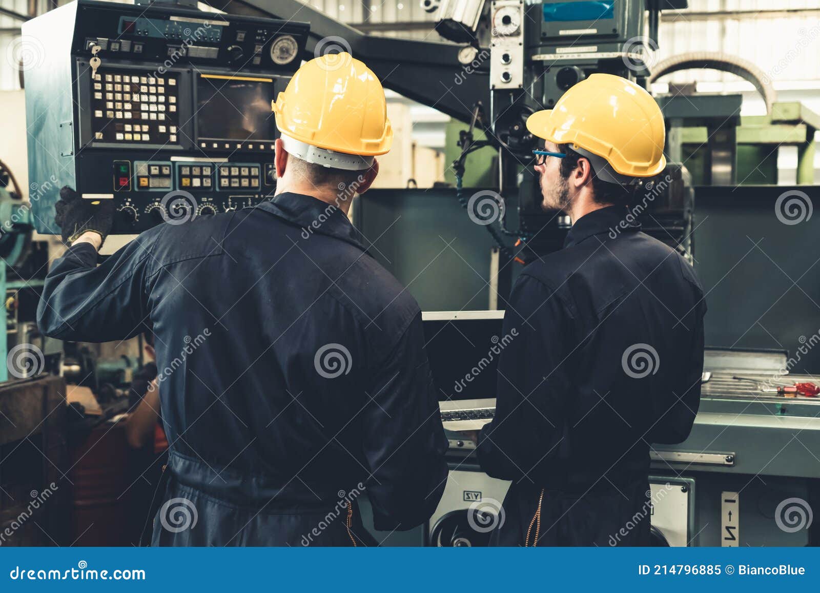Group of Skillful Factory Workers Using Machine Equipment in Workshop ...