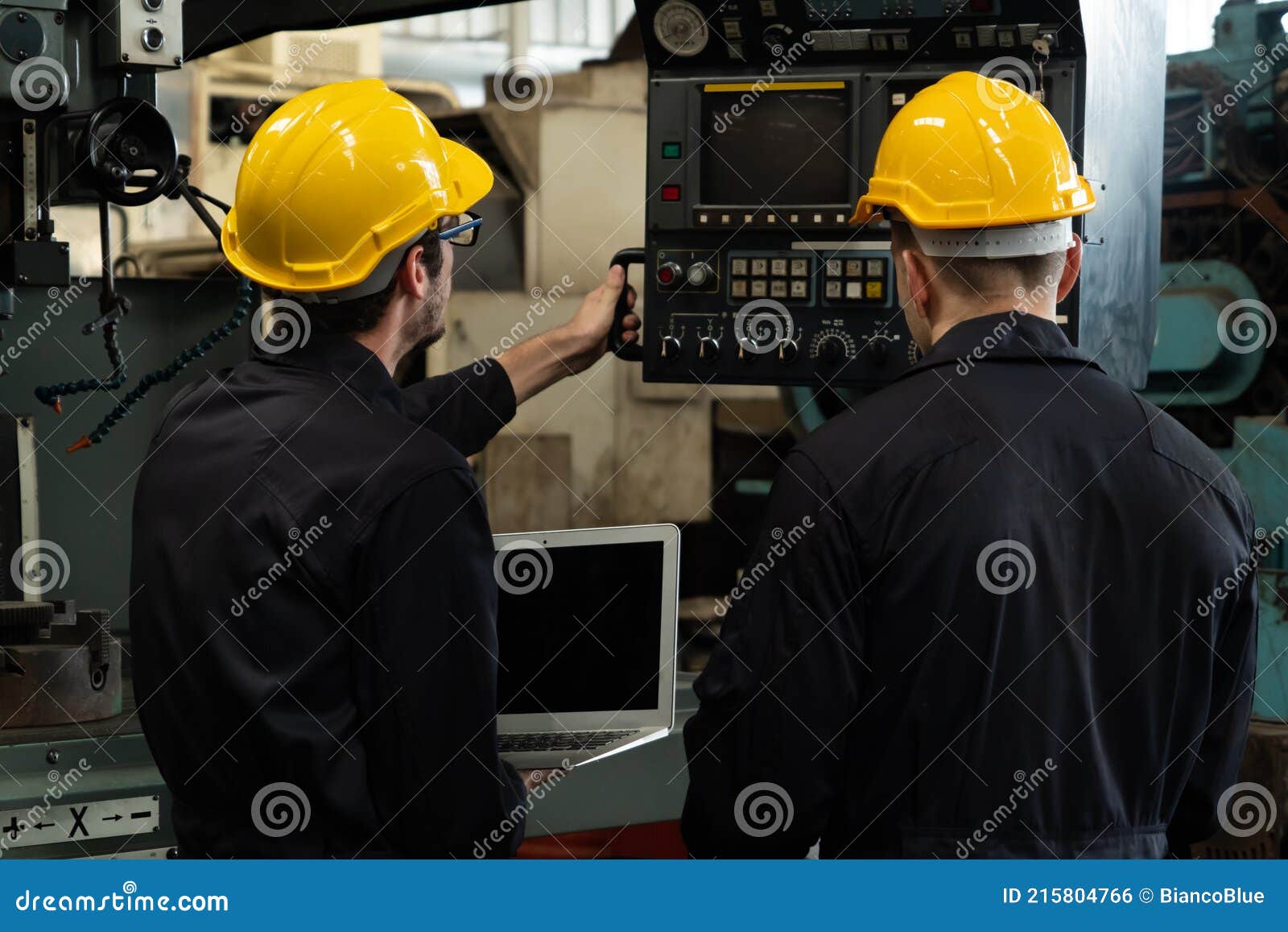 Group of Skillful Factory Workers Using Machine Equipment in Workshop ...