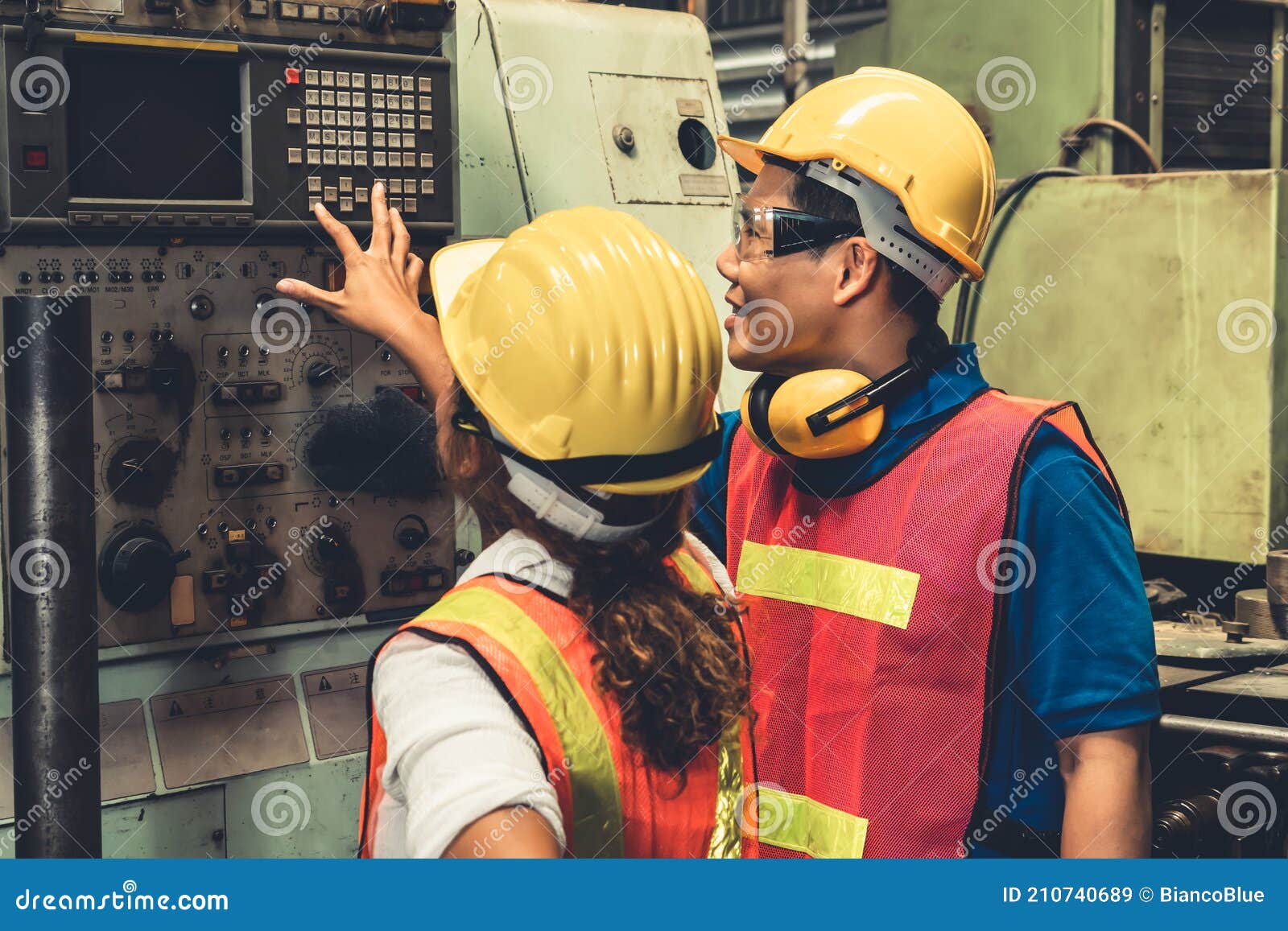 Group of Skillful Workers Using Machine Equipment in Factory Workshop ...