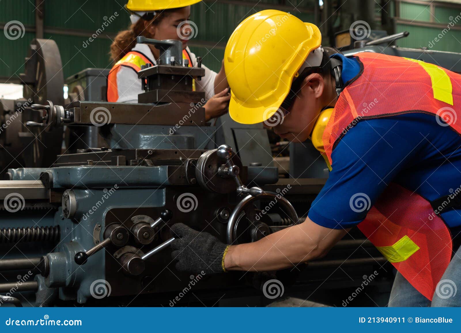 Group of Skillful Workers Using Machine Equipment in Factory Workshop ...