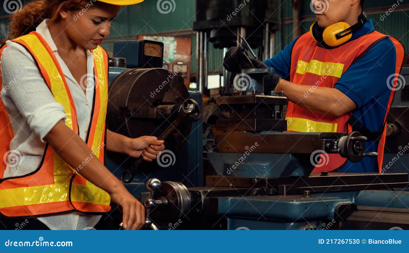 Group of Skillful Workers Using Machine Equipment in Factory Workshop ...