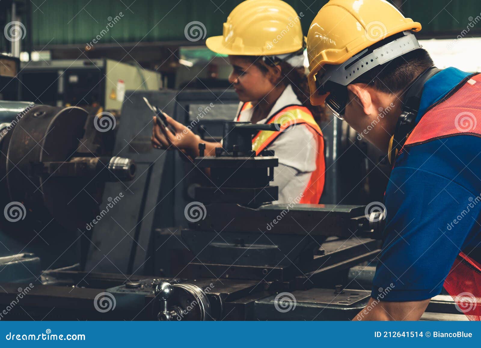 Group of Skillful Workers Using Machine Equipment in Factory Workshop ...