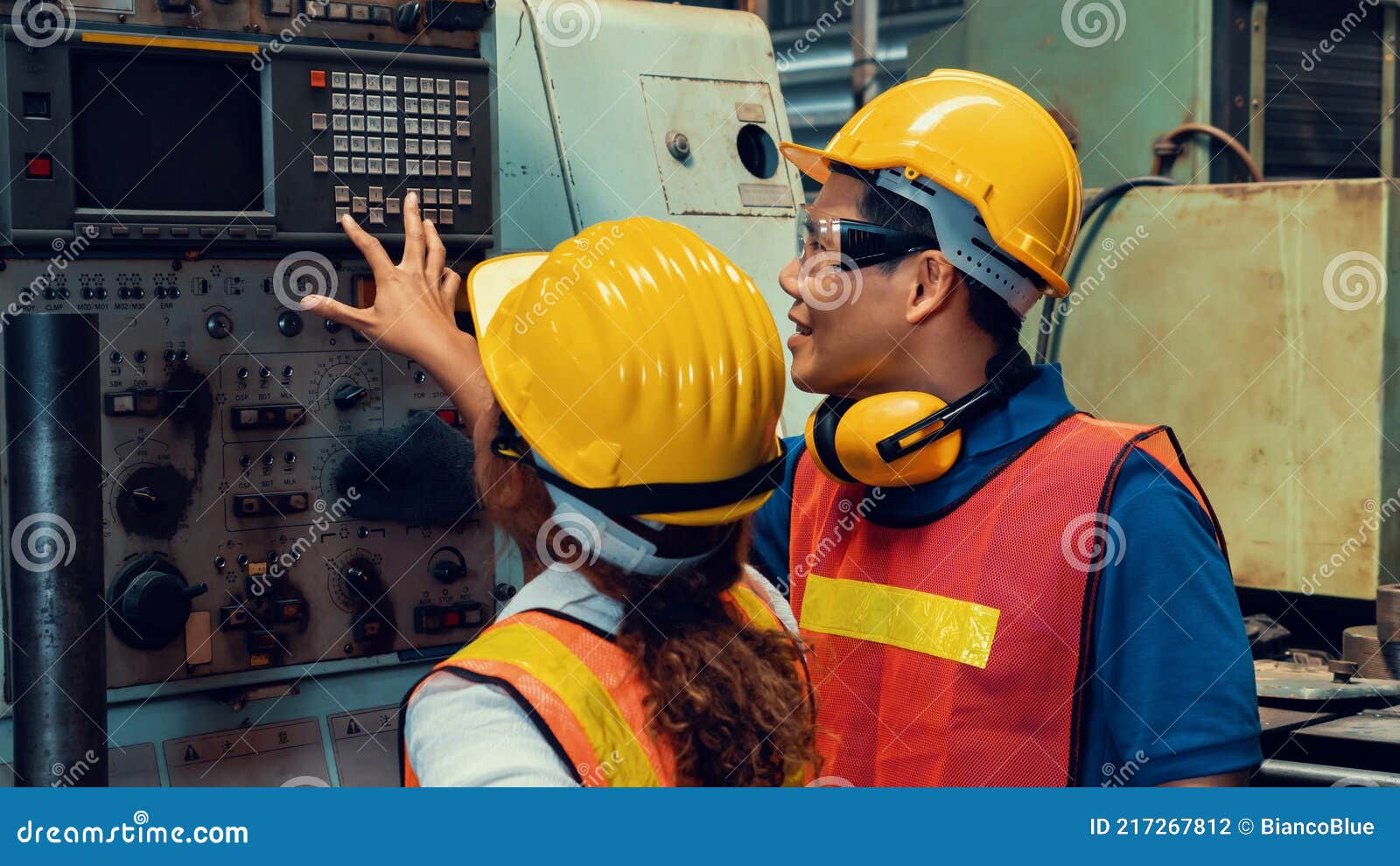 Group of Skillful Workers Using Machine Equipment in Factory Workshop ...