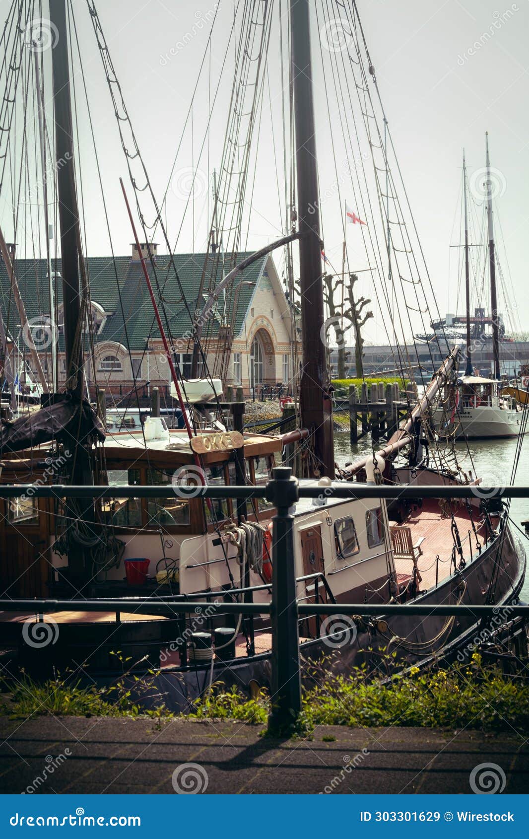 A Group of Small Boats Docked at a Harbor with People on Deck Editorial ...
