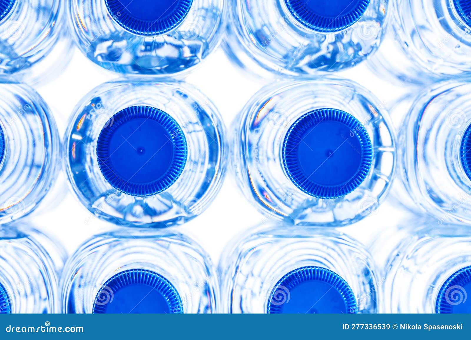 Group of Small Plastic Water Bottles with Blue Cap Stock Image - Image ...