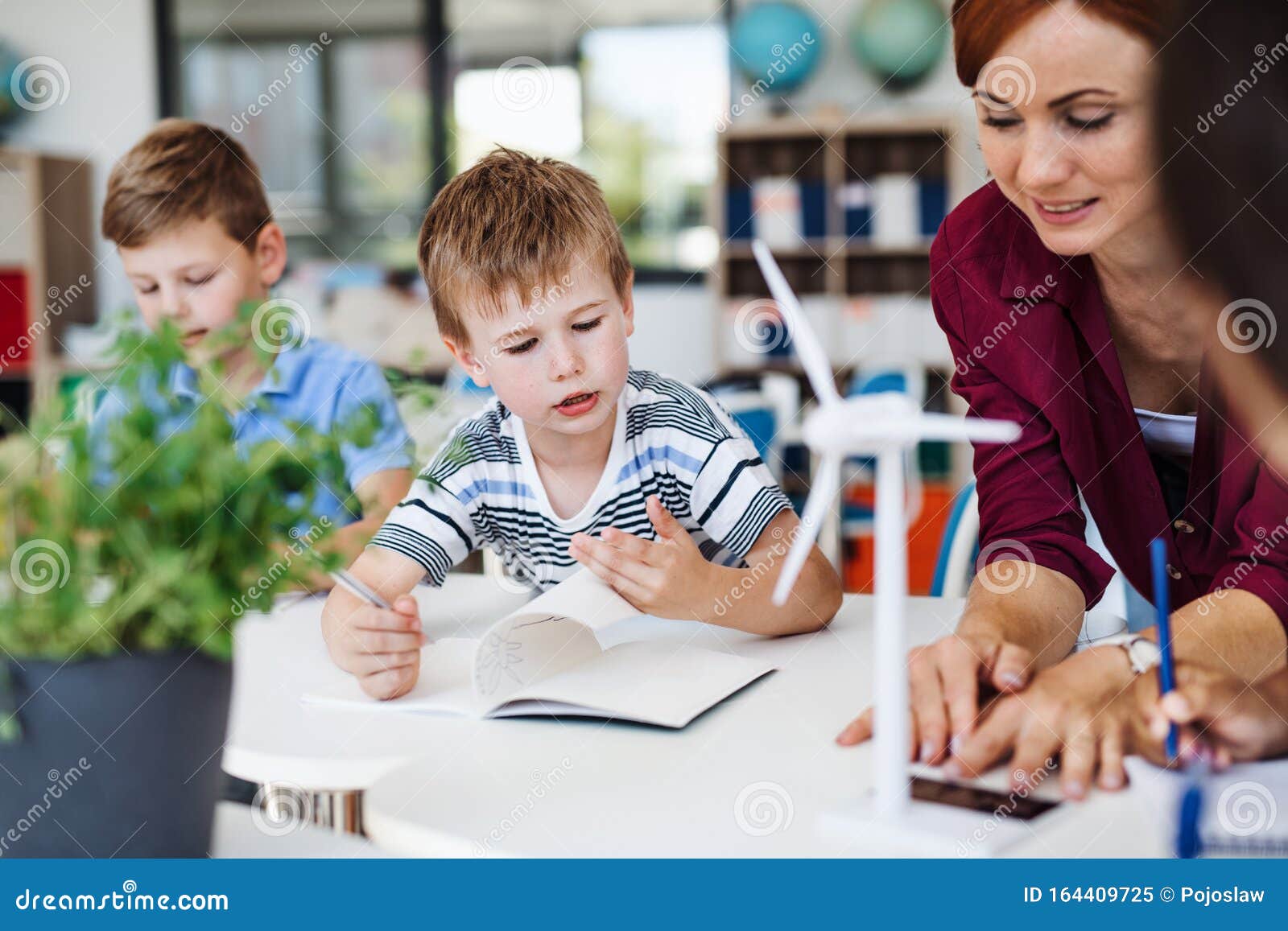 A Group of Small School Kids with Teacher Sitting in Circle in Class ...