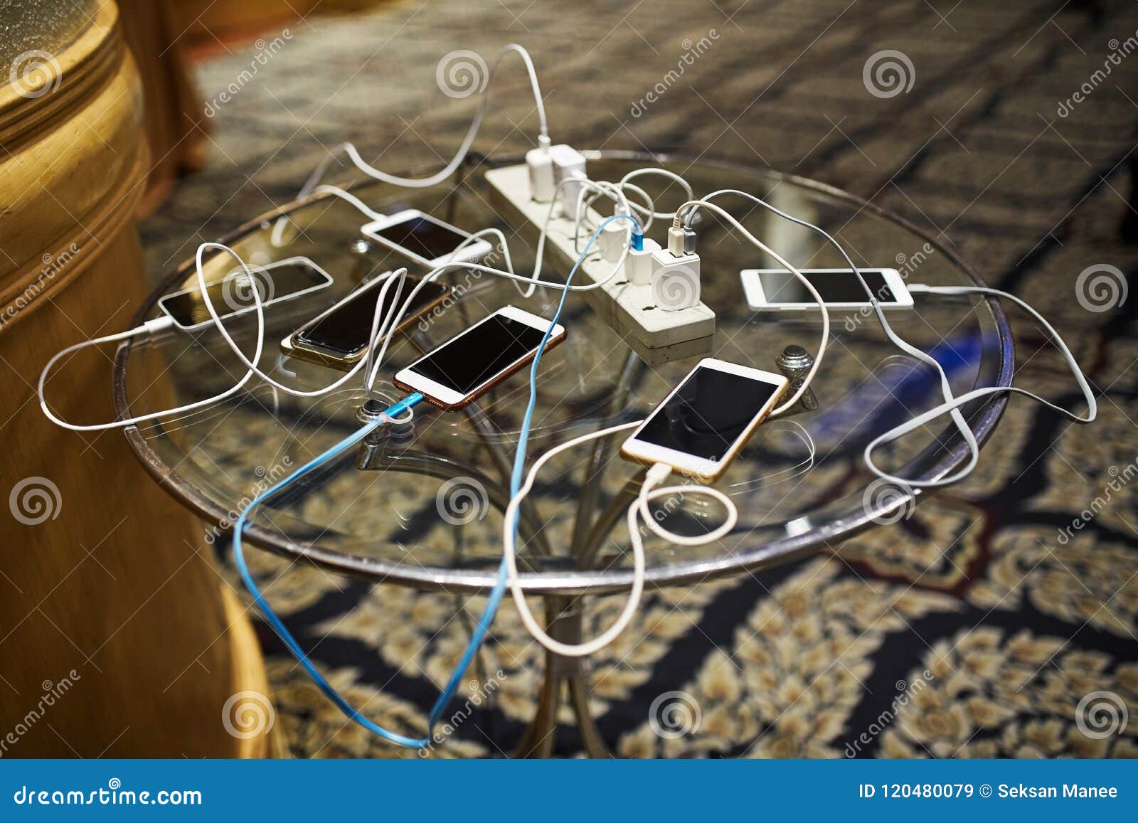 Group of Smartphones Charging on the Table Stock Image - Image of ...